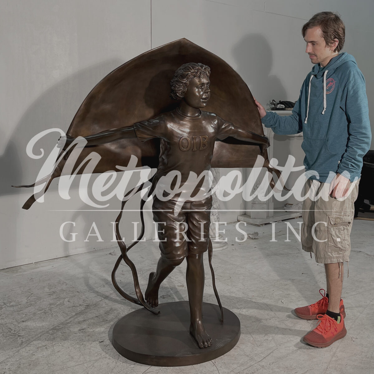 Bronze Boy Flying Kite Sculpture - Metropolitan Galleries Inc.